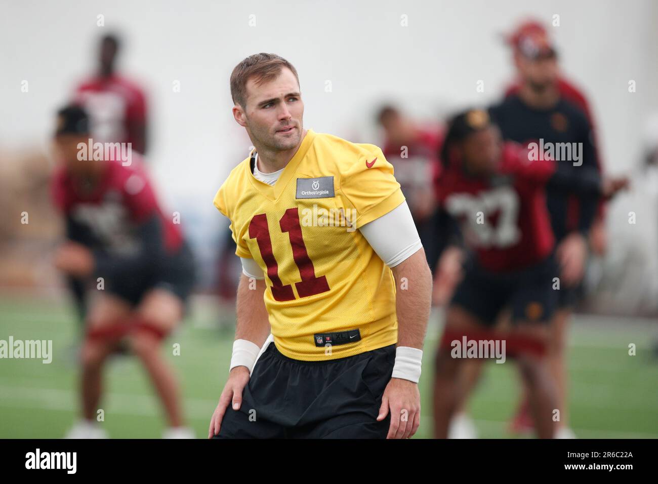 Washington Commanders quarterbacks Jake Fromm stretches during NFL ...