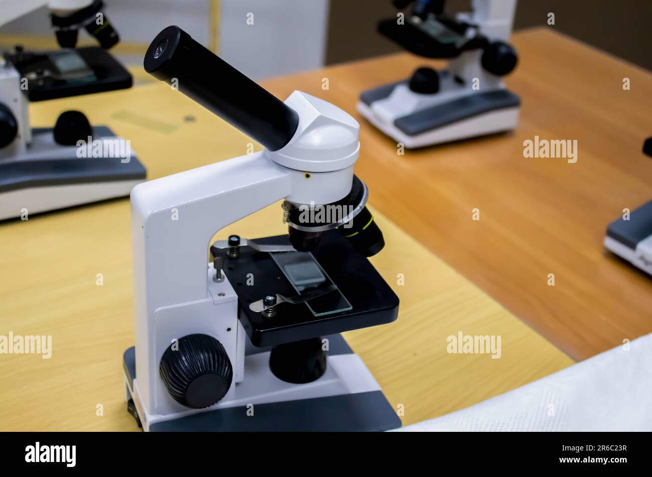old microscope isolated on white background Stock Photo - Alamy