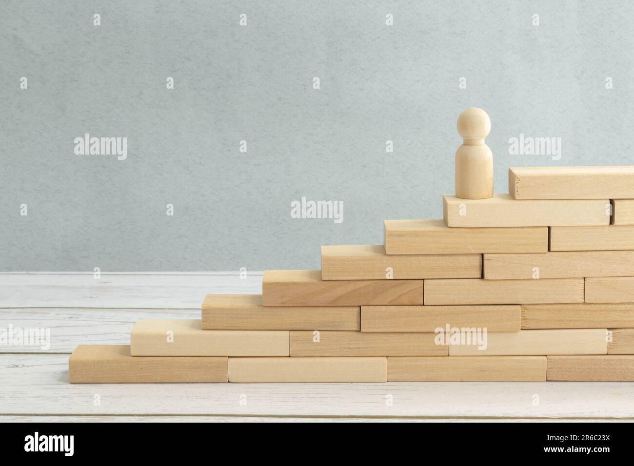 Wooden blocks in form of ladder upstairs red on dove background. Most ...