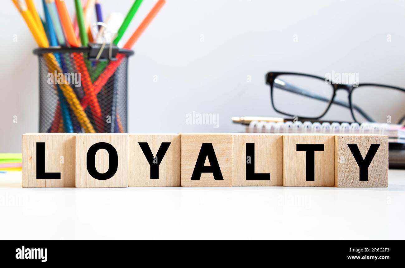 Loyalty Word In Wooden Cube Stock Photo - Alamy