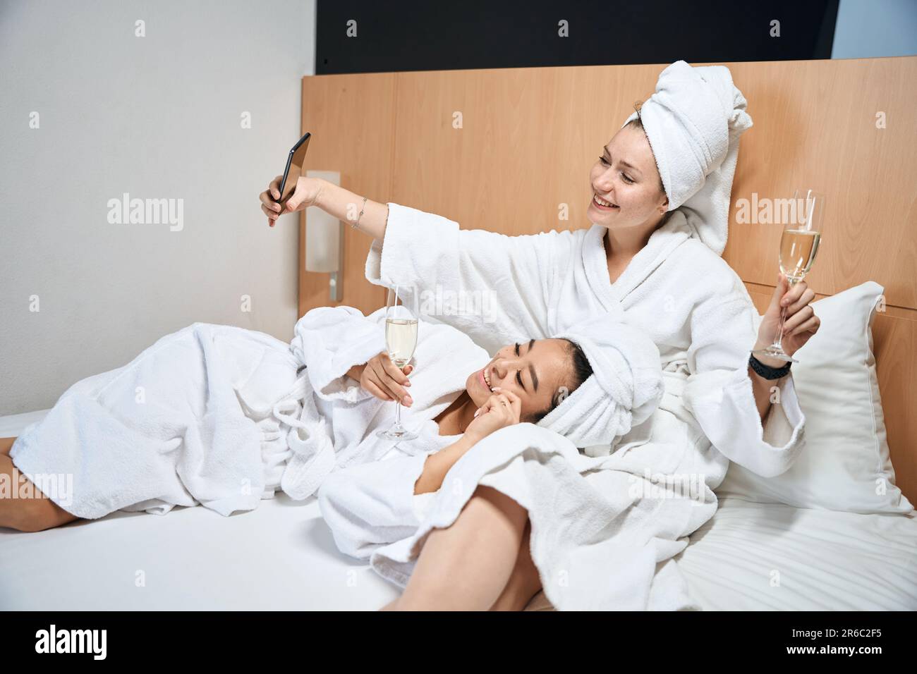 Selfie of two smiling women in a hotel room Stock Photo - Alamy