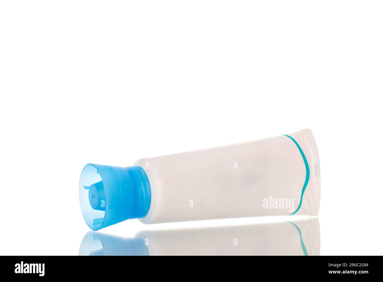 One plastic tube of toothpaste, macro, isolated on white background ...