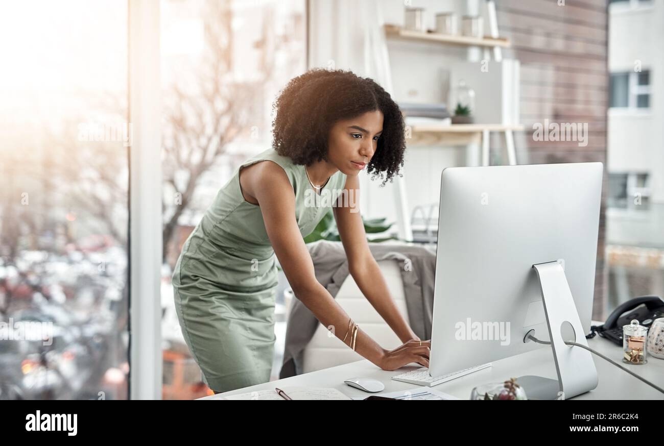 Computer, schedule and woman planner typing and working by her desk or ...