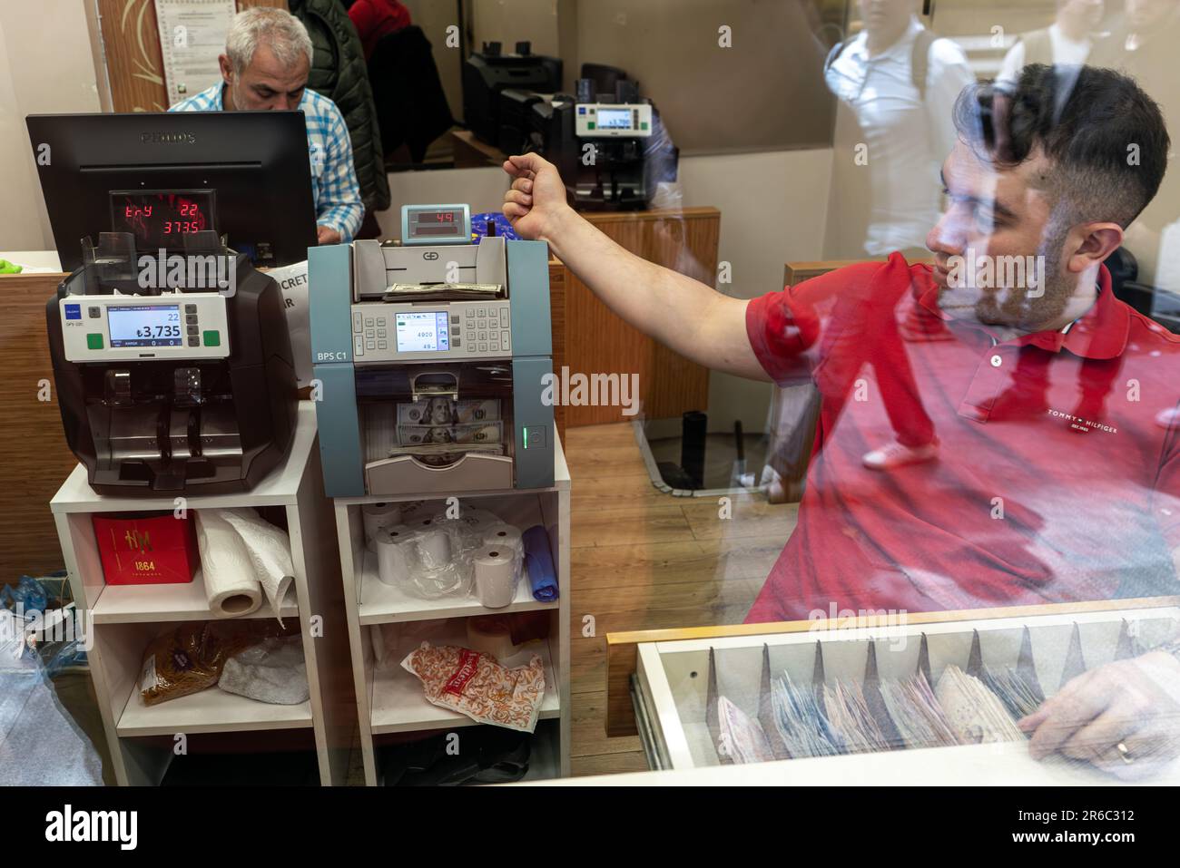Man on bank counter images hi-res stock photography and images - Alamy