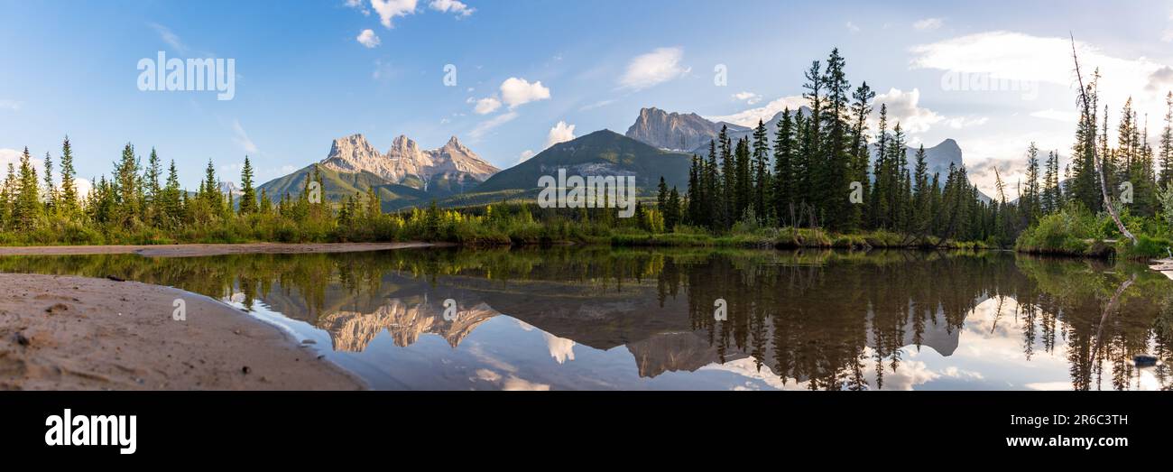 Wilderness area in Canmore with Three Sisters in the background on blue ...