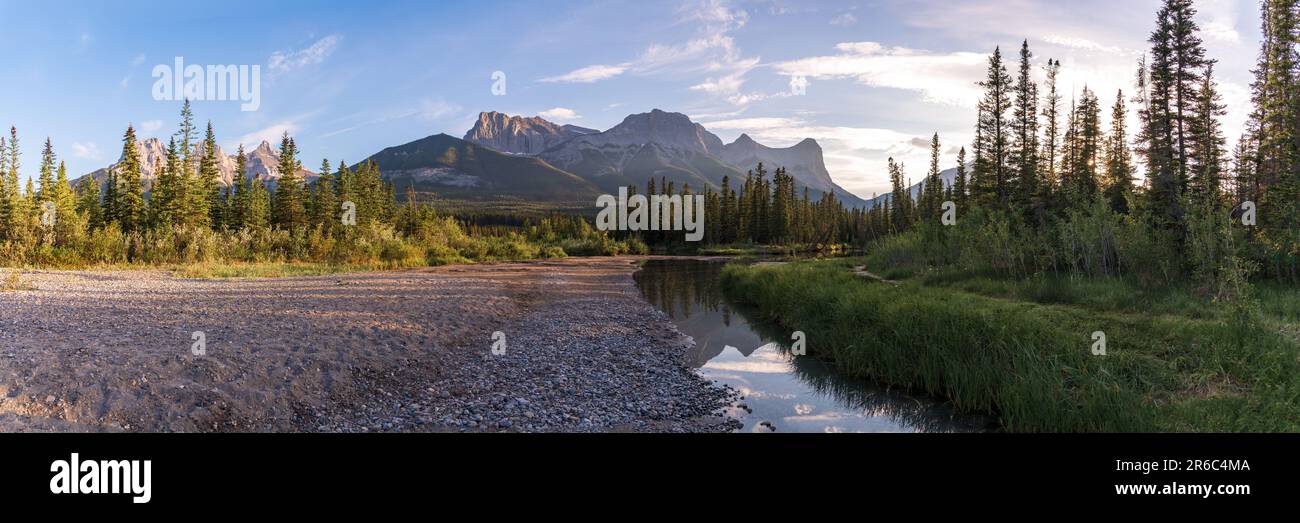 Panoramic view of the Three Sisters in Canmore, Alberta during ...