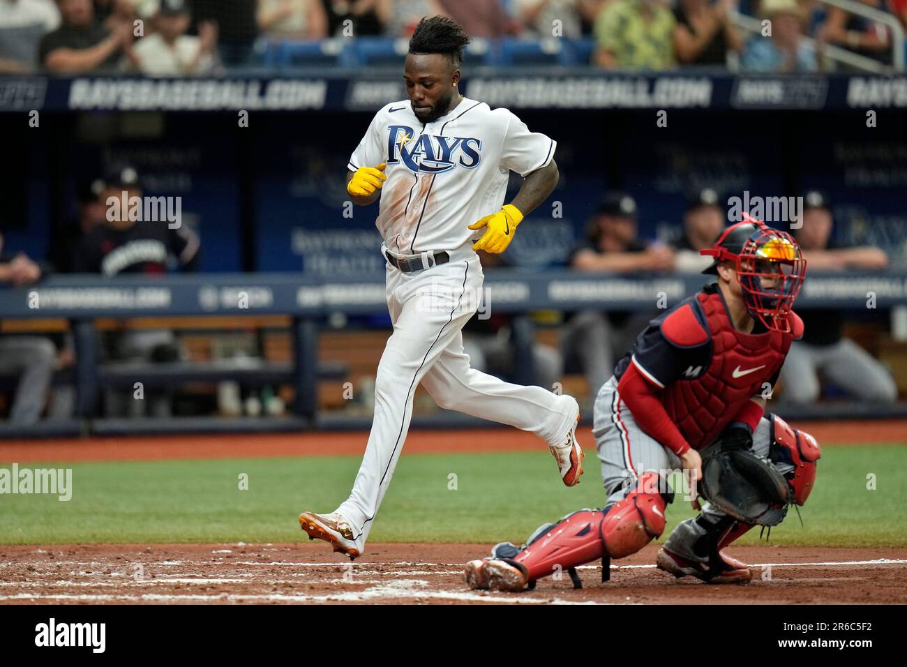 Tampa Bay Rays' Randy Arozarena, left, scores behind Minnesota Twins ...