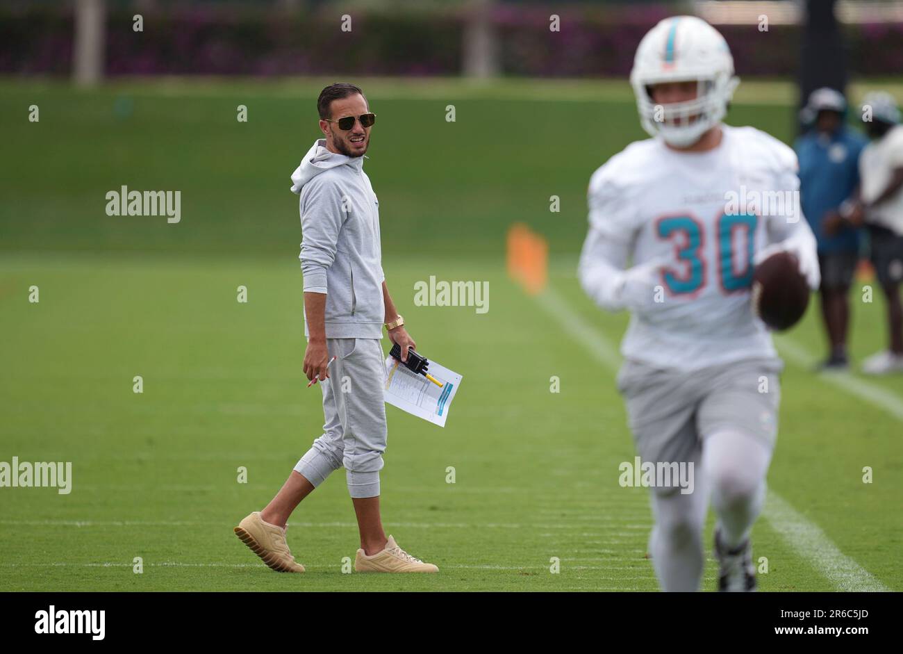 Miami Dolphins head coach Mike McDaniel watches fullback Alec Ingold ...