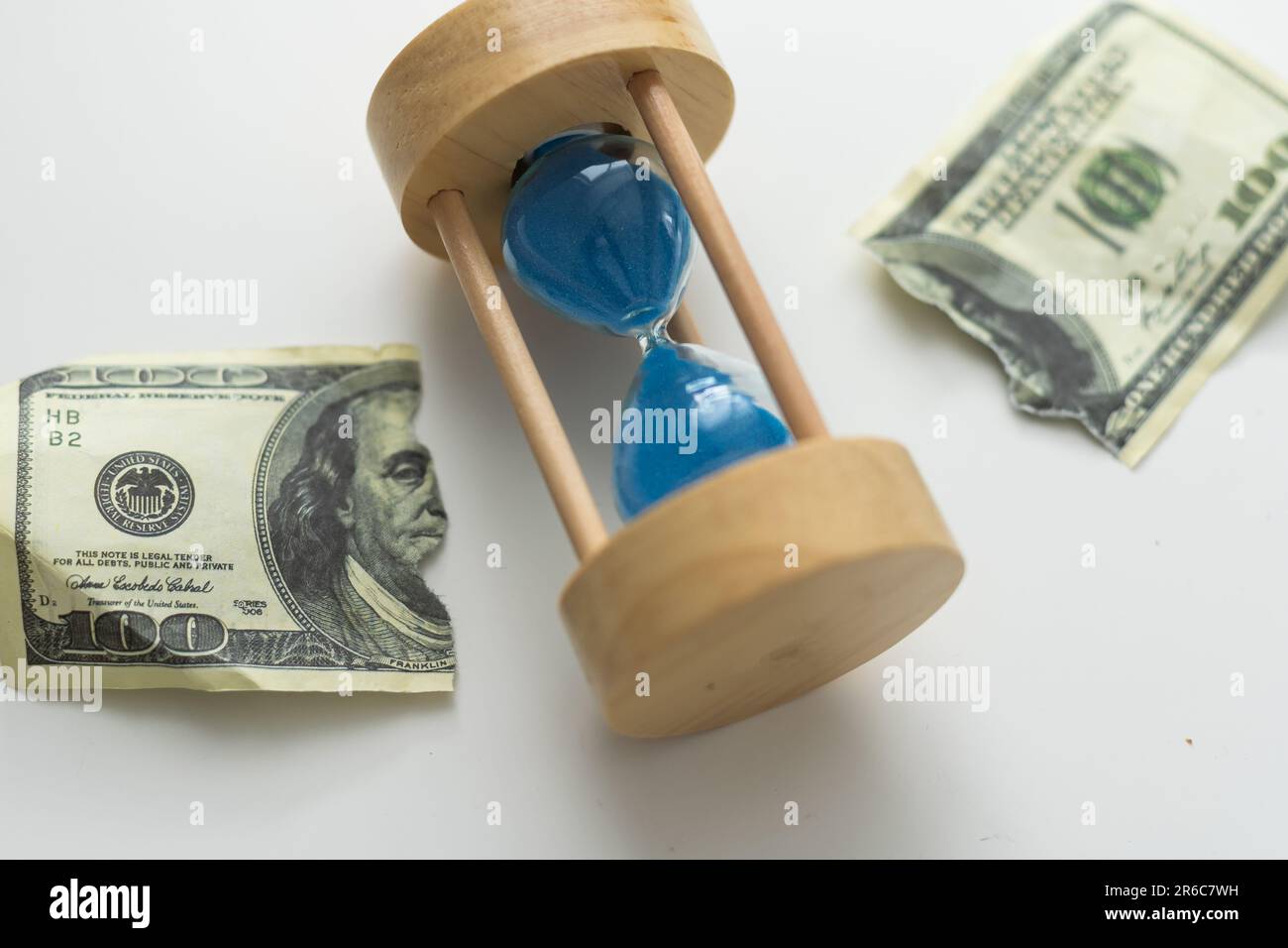 One Hundred Dollar Bill Ripped in Half Isolated on a White Background ...