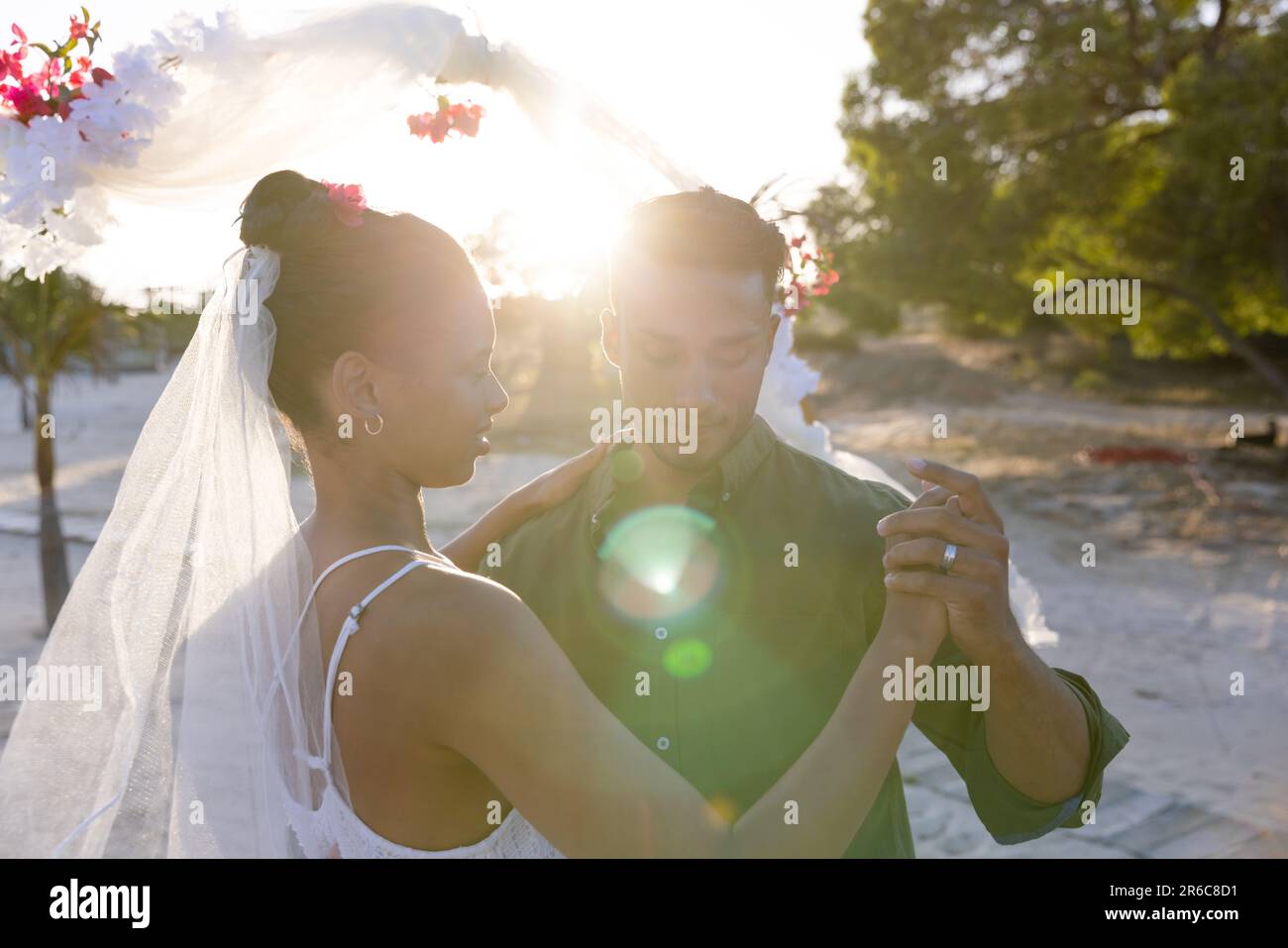 Romantic caucasian newlywed young couple dancing at beach at wedding ...