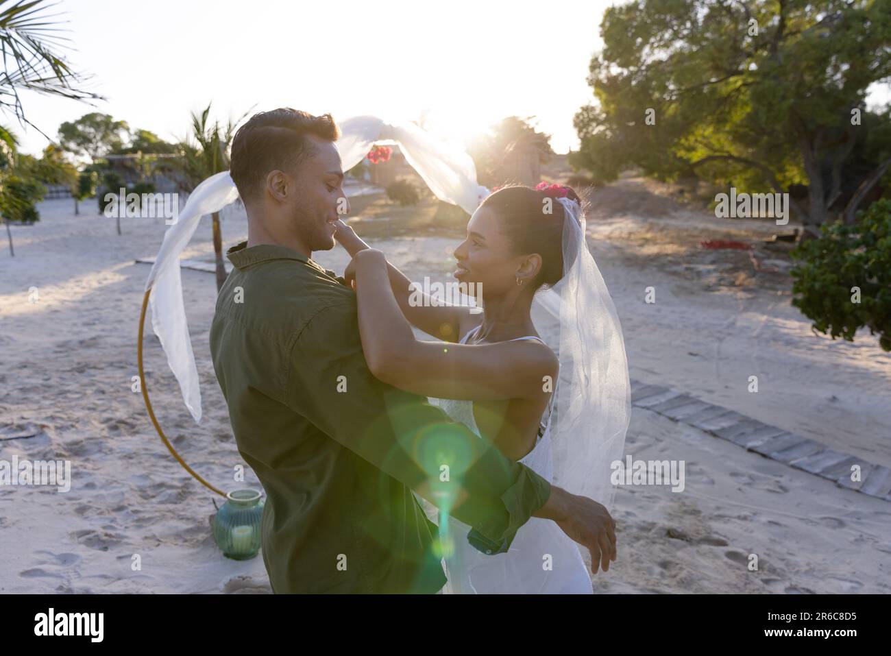Side view of caucasian newlywed couple dancing at wedding ceremony at ...