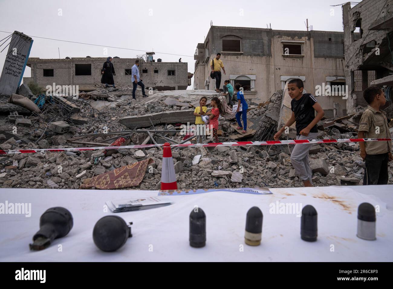 Residents view mortar shells and fragments of exploded Israeli missiles ...