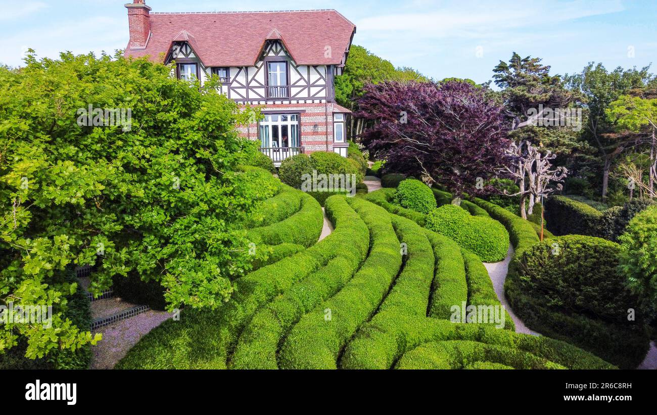 Etretat gardens in town Etrtat in normandy with amazing topiary plnats: shrubs and trees . May ...
