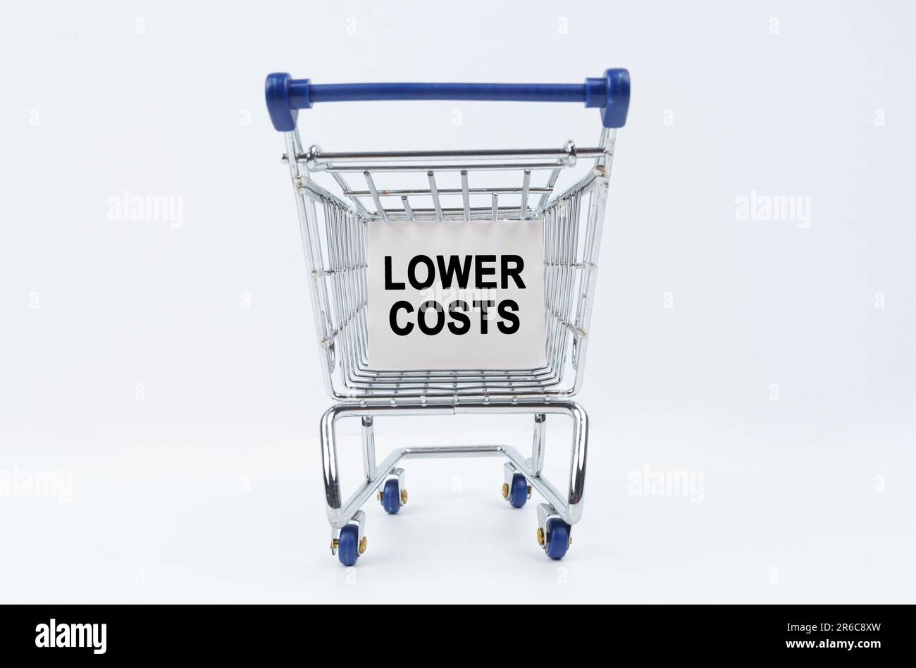 Business concept. On a white background is a shopping cart with a sign ...