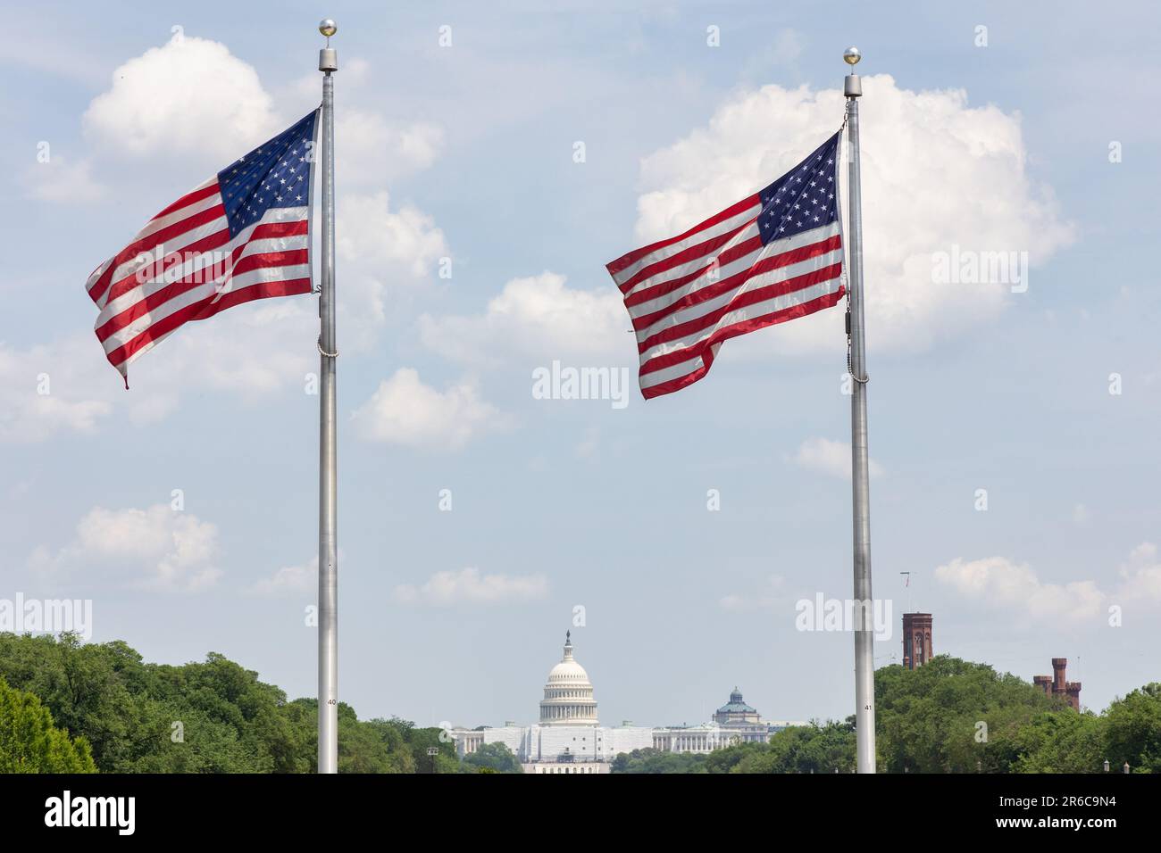 US Capitol building viewed between two american flags Stock Photo - Alamy