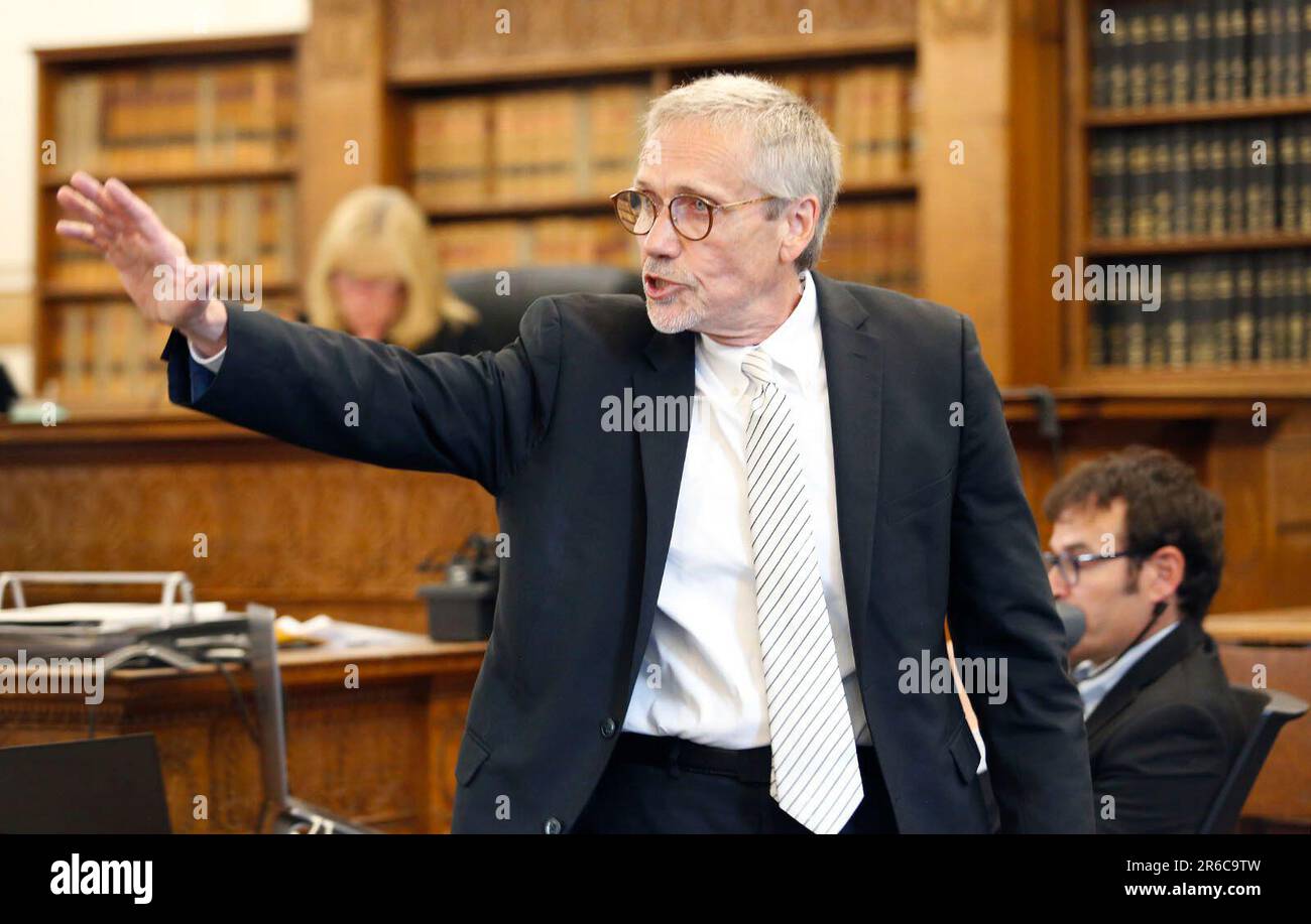 Defense attorney Larry Lipton gestures toward his client during his ...