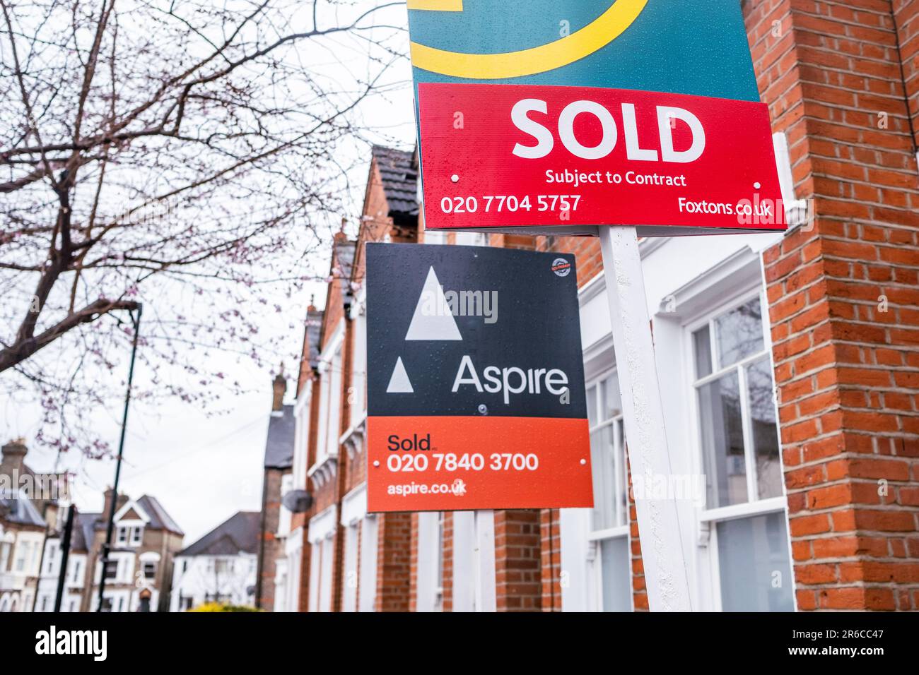 LONDON- MARCH, 2023: Estate Agent sold signs on residential street in ...