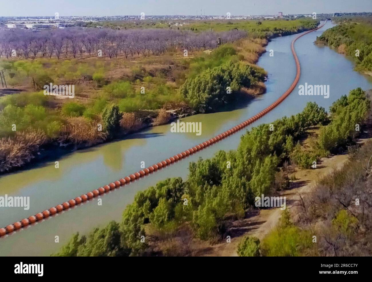 An illustration of a floating barrier in the Rio Grande River of Texas ...