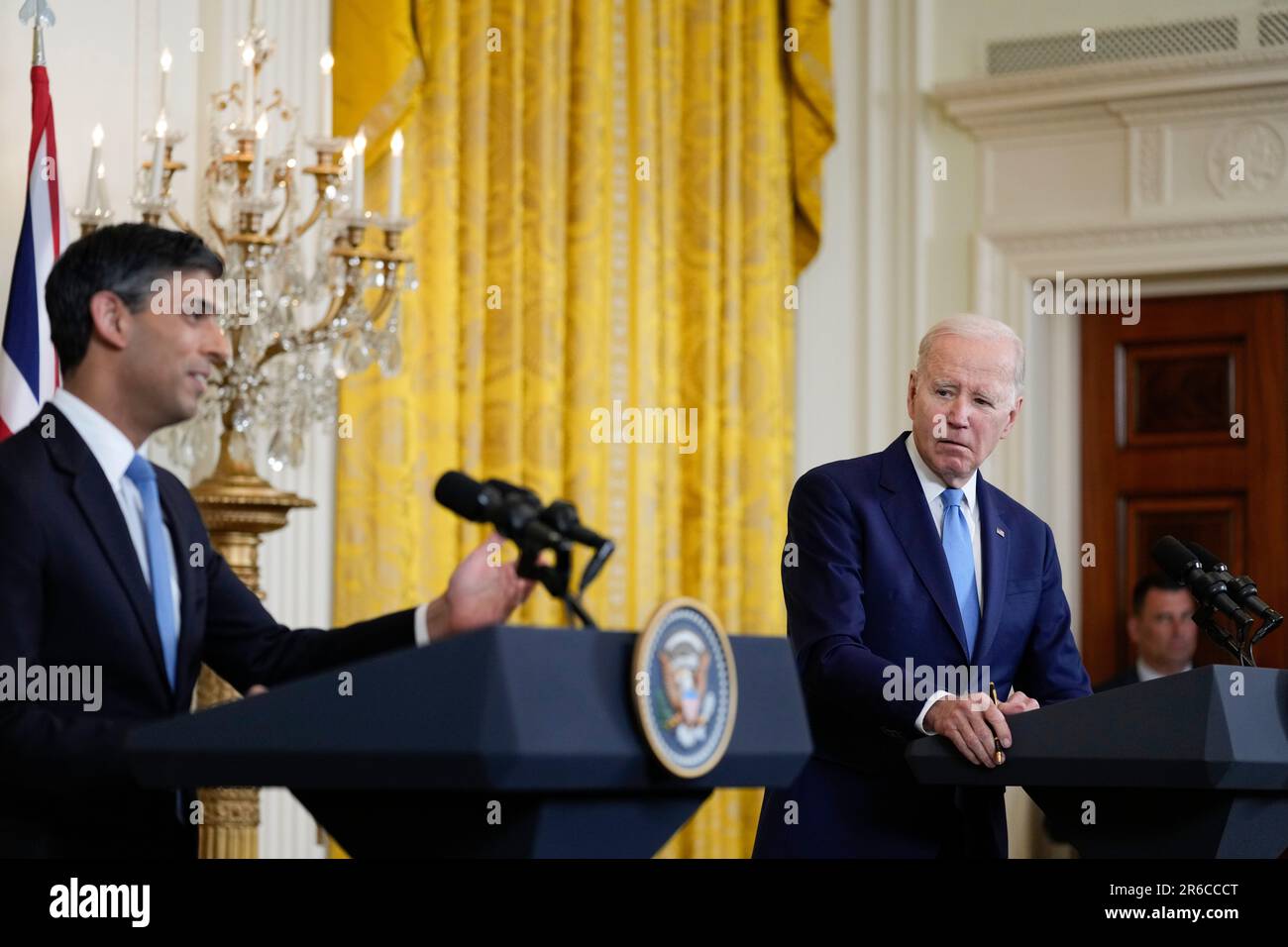 President Joe Biden listens during a news conference with British Prime ...