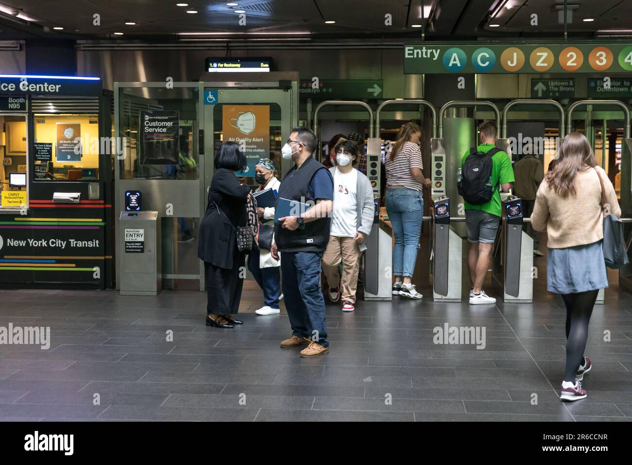 MTA employee gives out masks at the Fulton Street subway station amid ...
