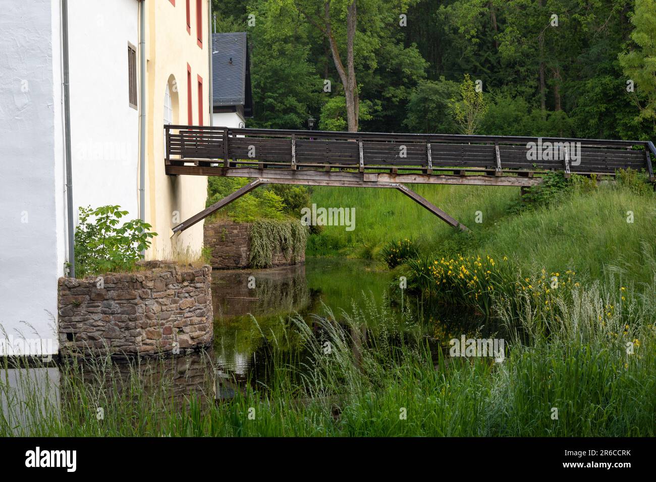 The bridge over a moat at a water castle Stock Photo - Alamy