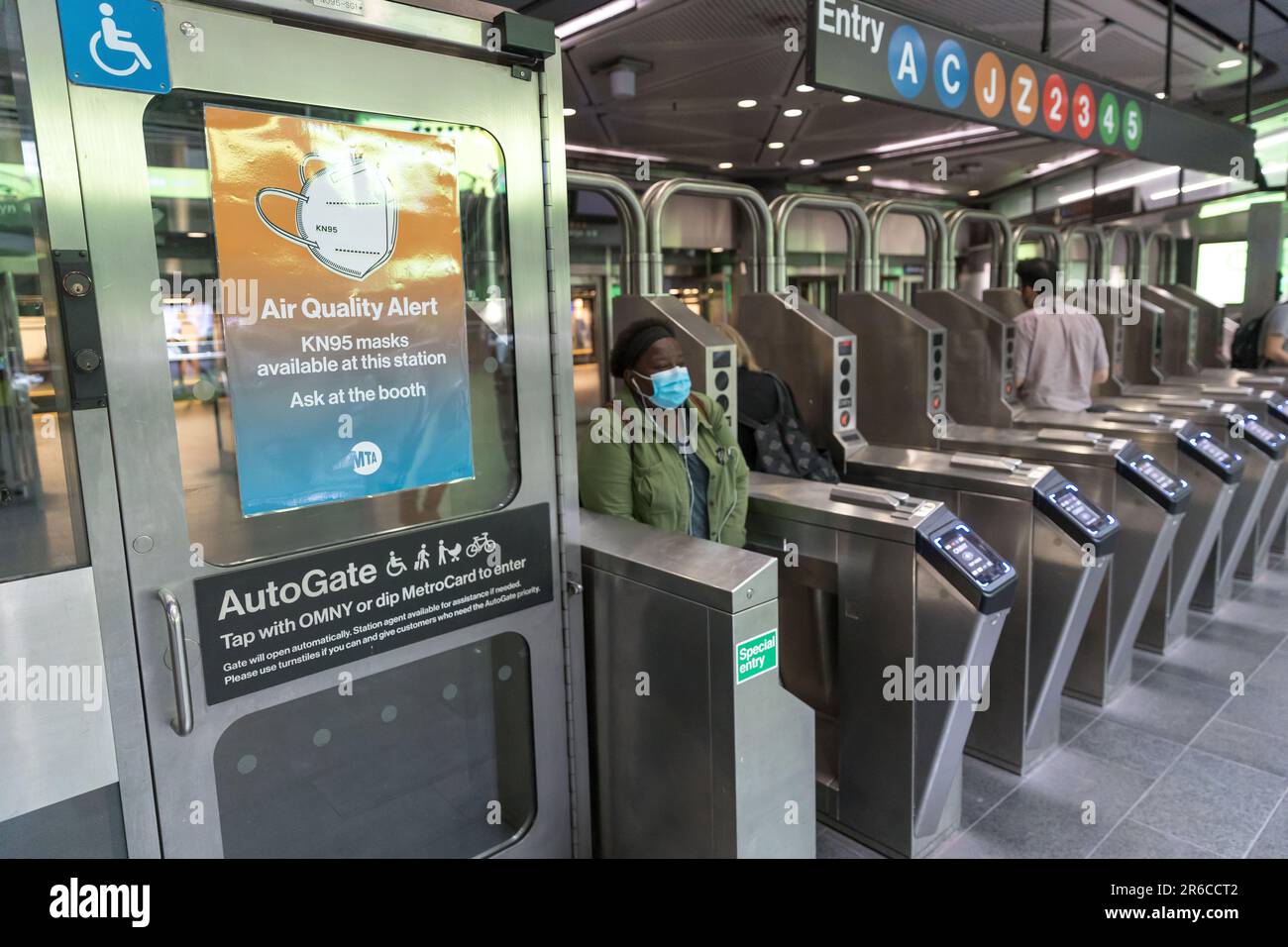 MTA employee gives out masks at the Fulton Street subway station amid ...