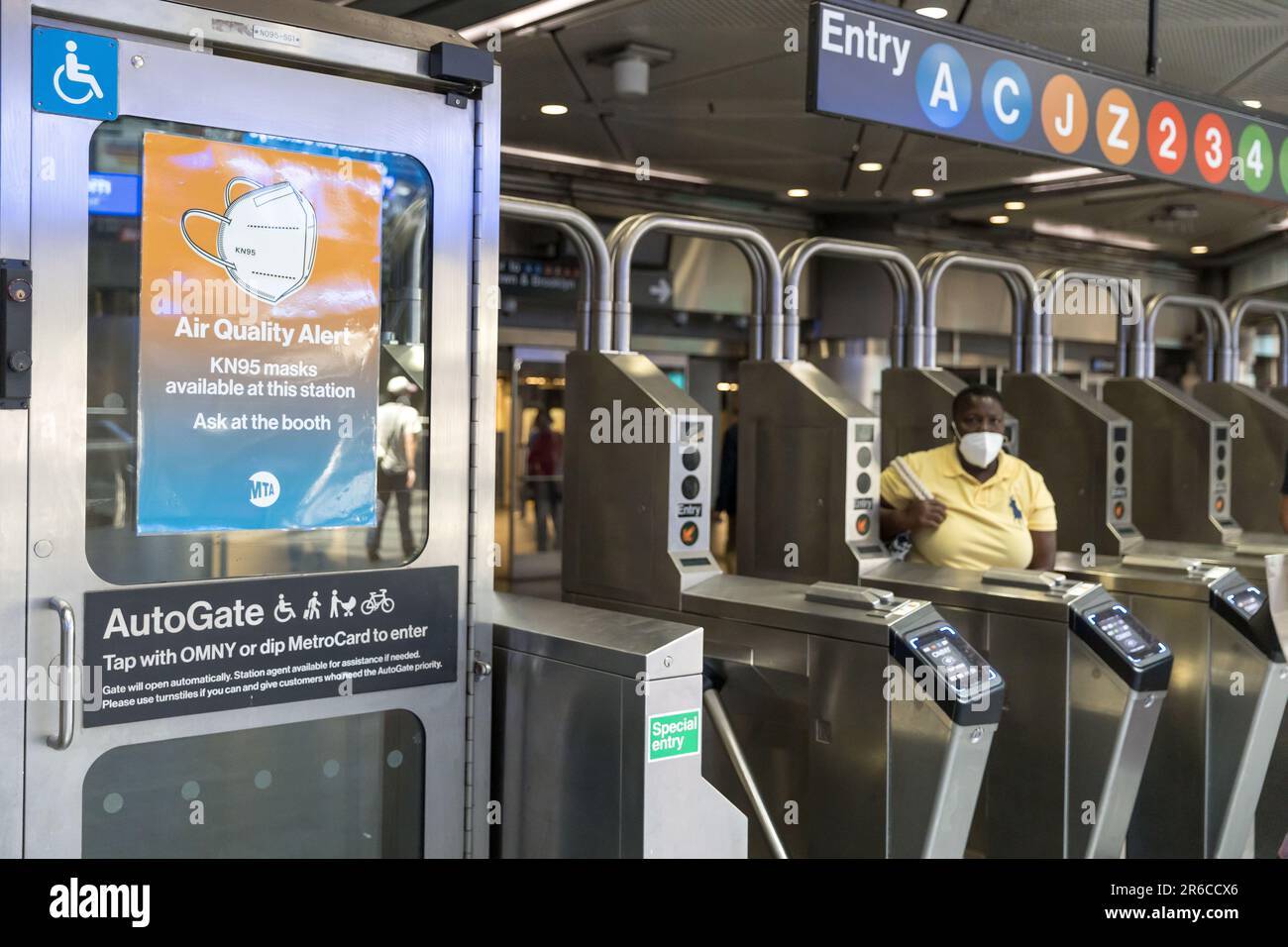 MTA employee gives out masks at the Fulton Street subway station amid ...