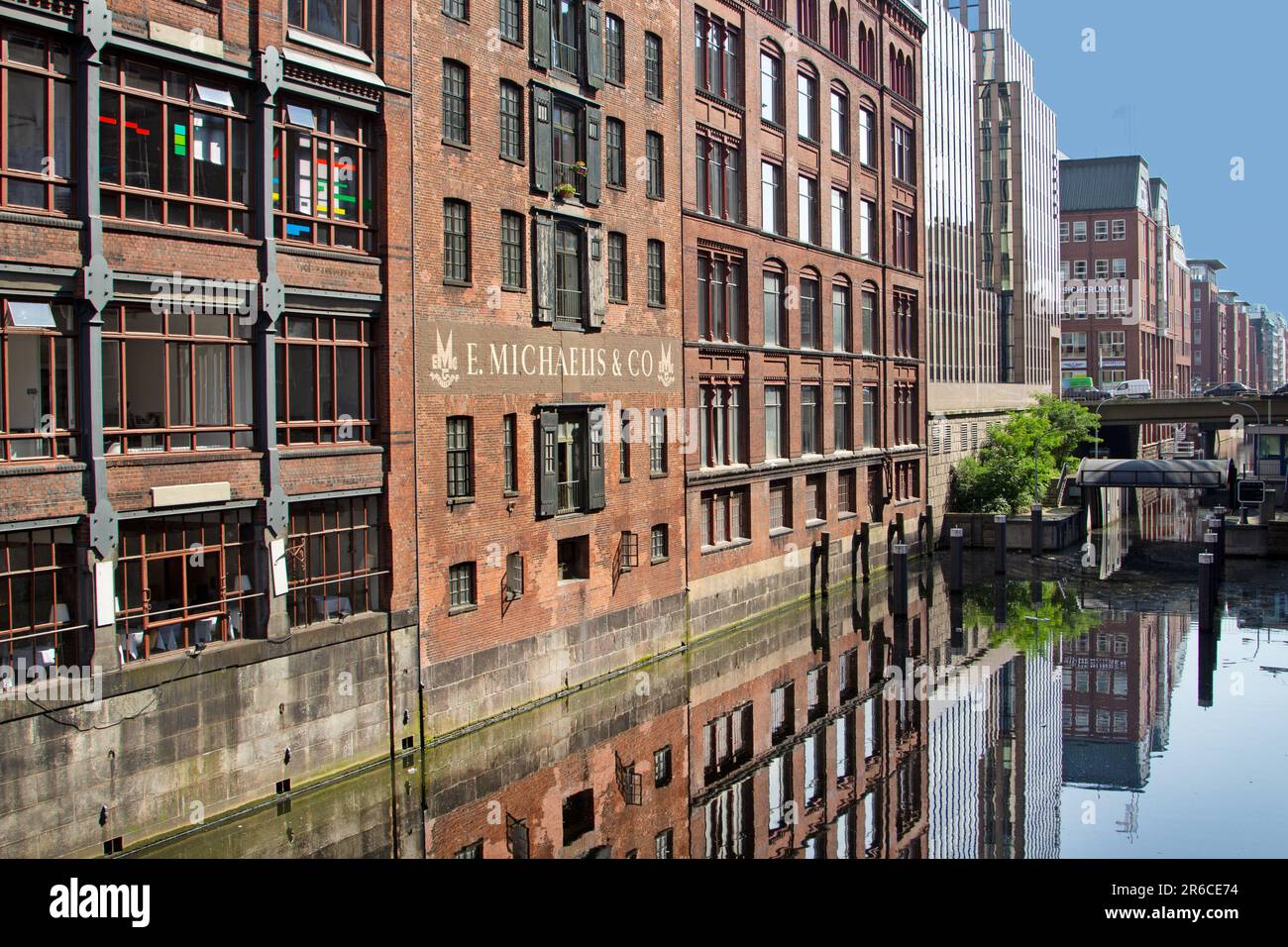 Hamburg, Germany - July 25, 2012: reflection of brick houses and bridge ...