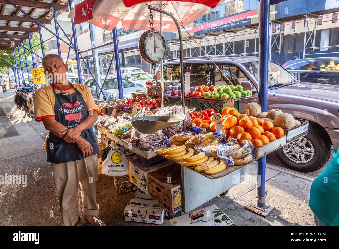 New York, USA - July 11, 2010: street hawker sells fresh fruits at the ...