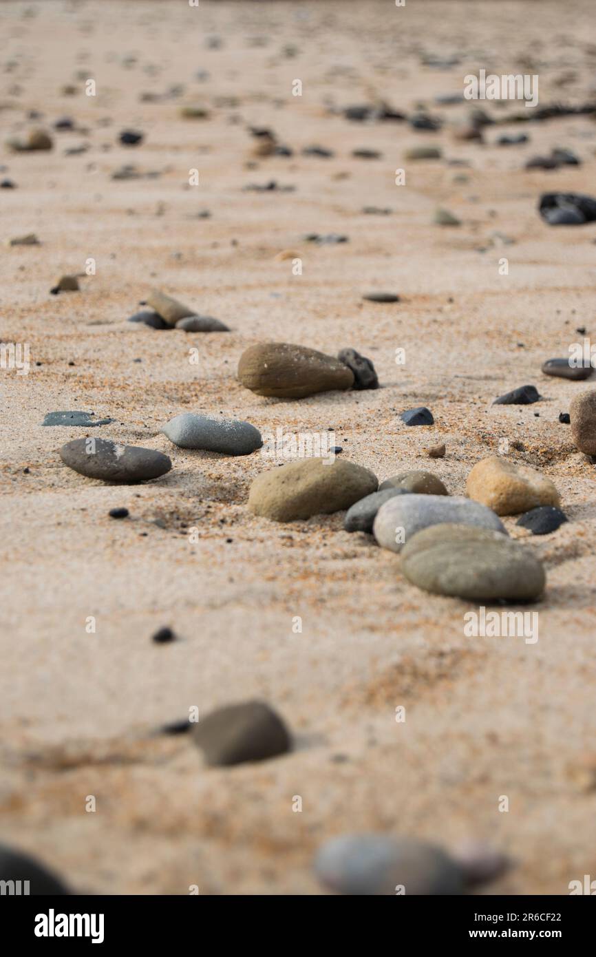 Pebbles on sandy shore hi-res stock photography and images - Alamy