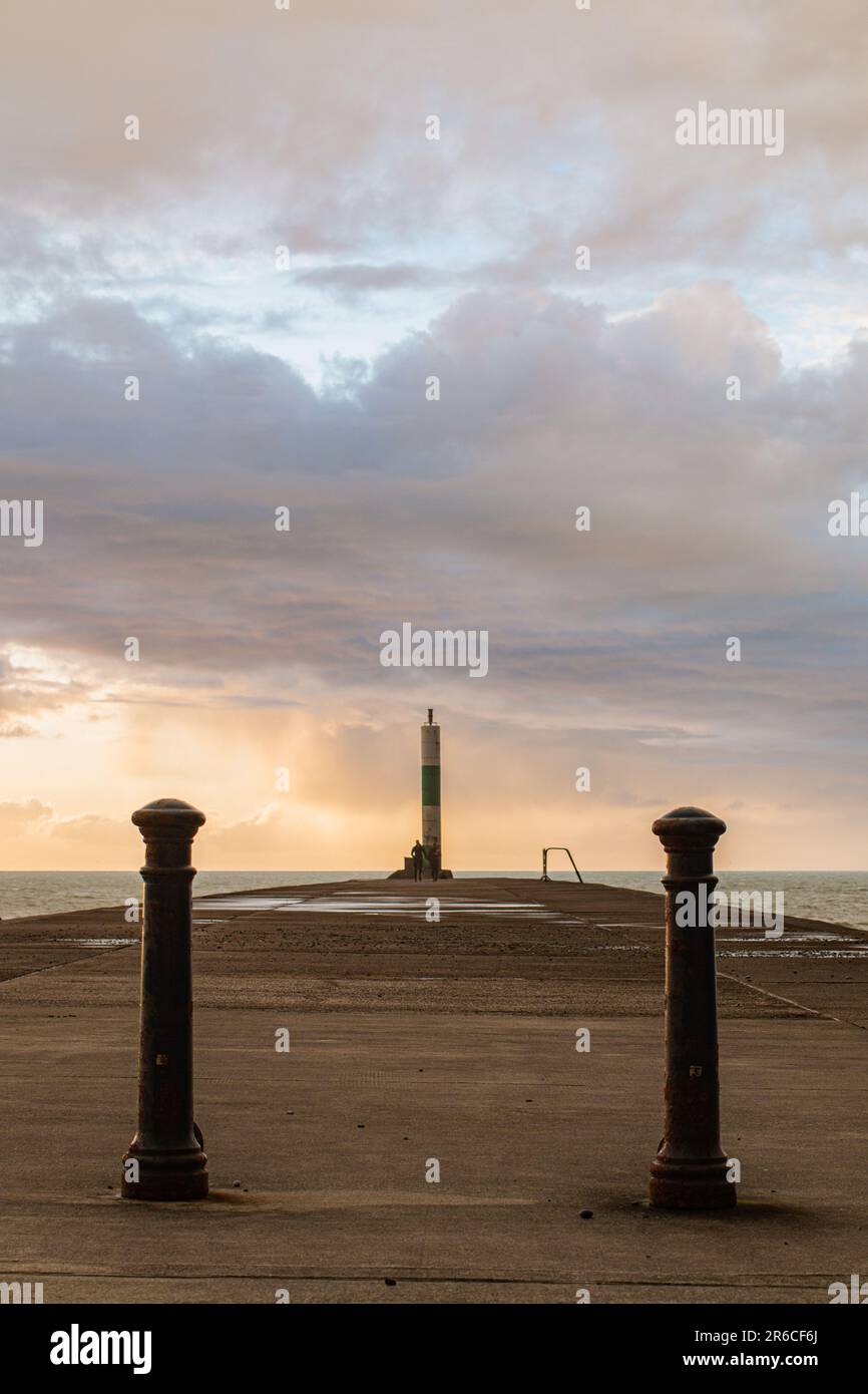 2 posts heading down the jetty to the lighthouse of Tan Y Bwlch ...
