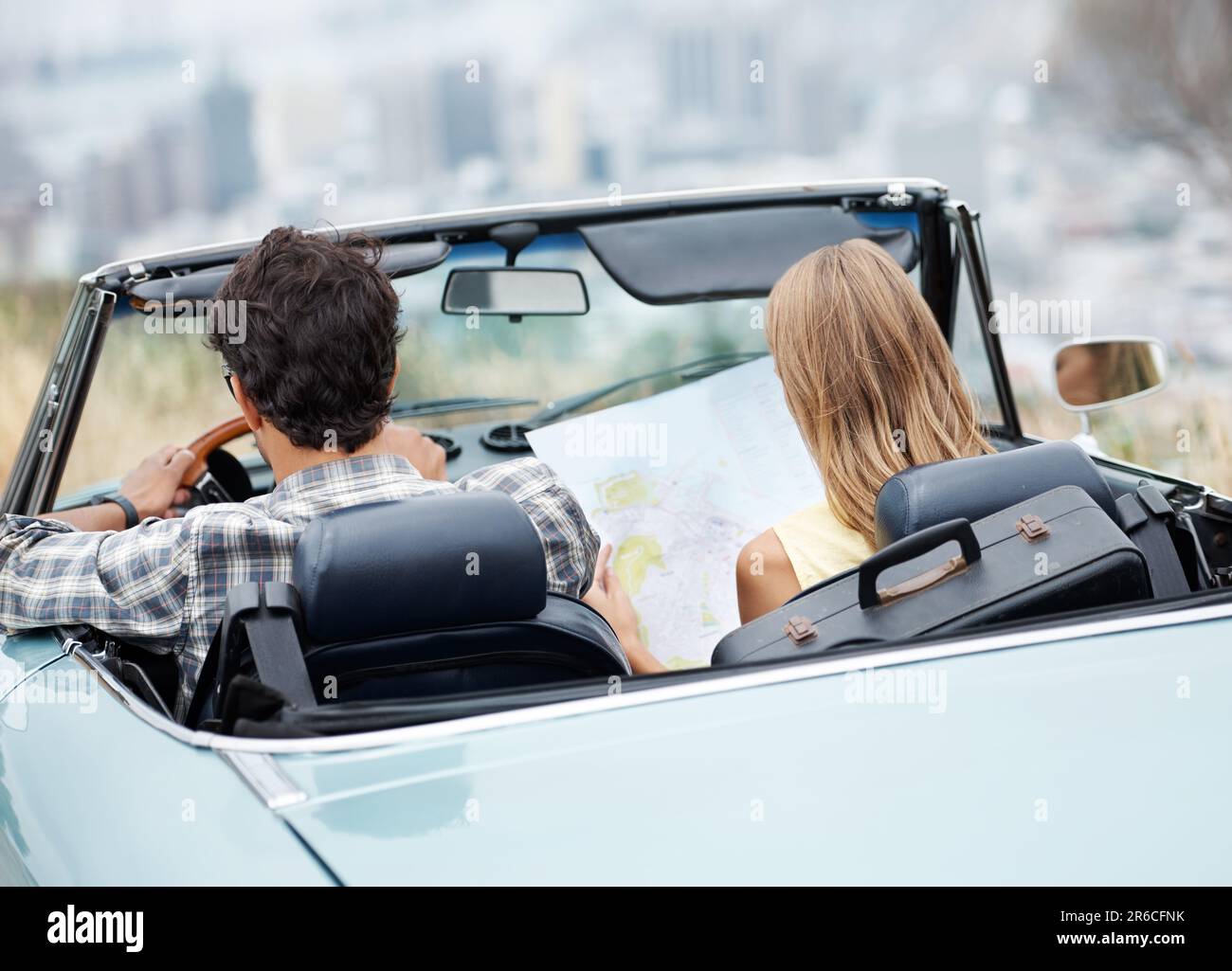 Trying to find their way. Rear view of a young couple in their ...