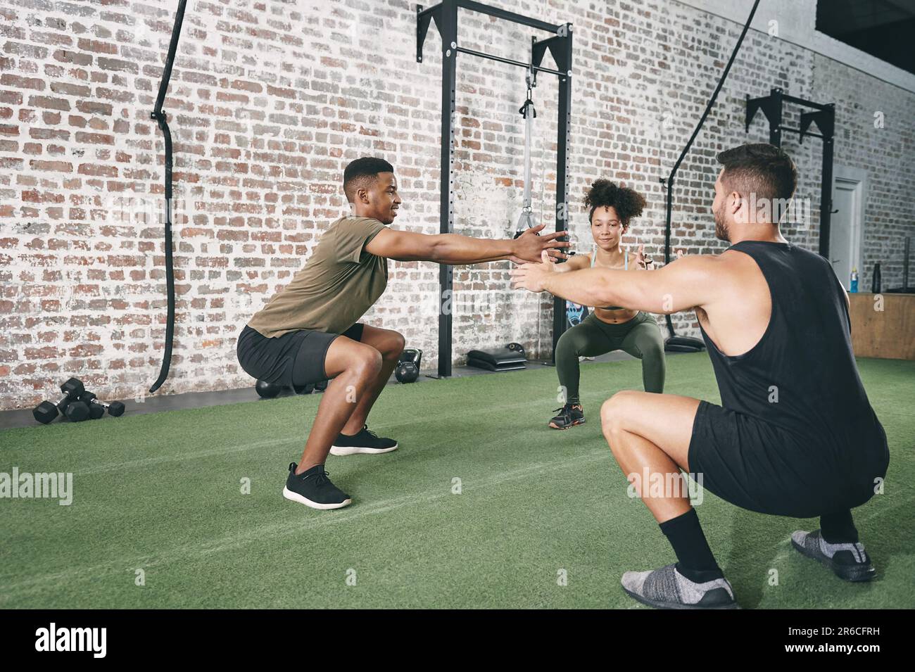 Life has its ups and downs, we call them squats. a fitness group doing ...