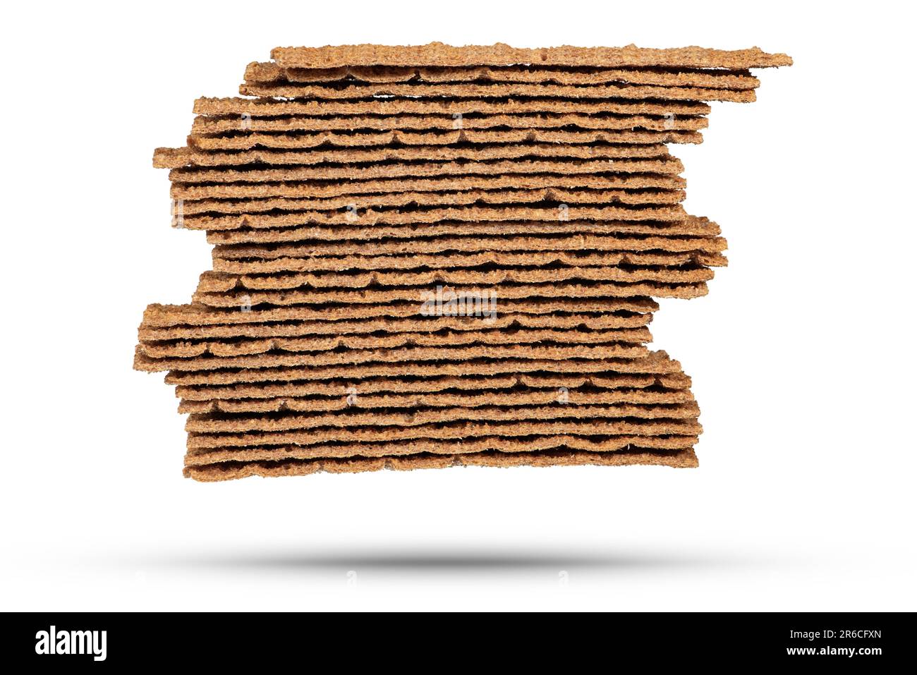 Texture of rye chips on a white background. The chips are stacked one ...