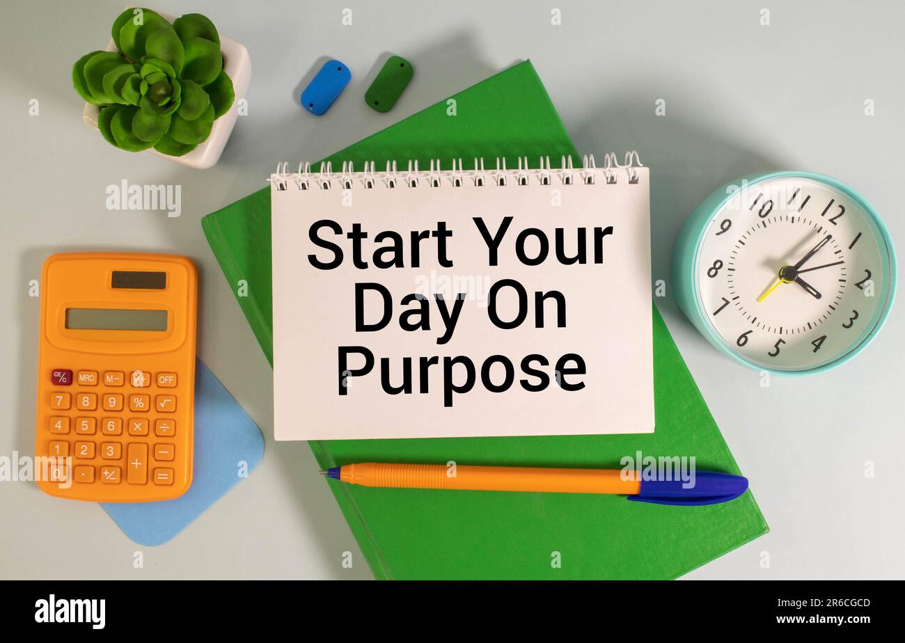 Start Your Day On Purpose text on notepad, concept background Stock Photo - Alamy