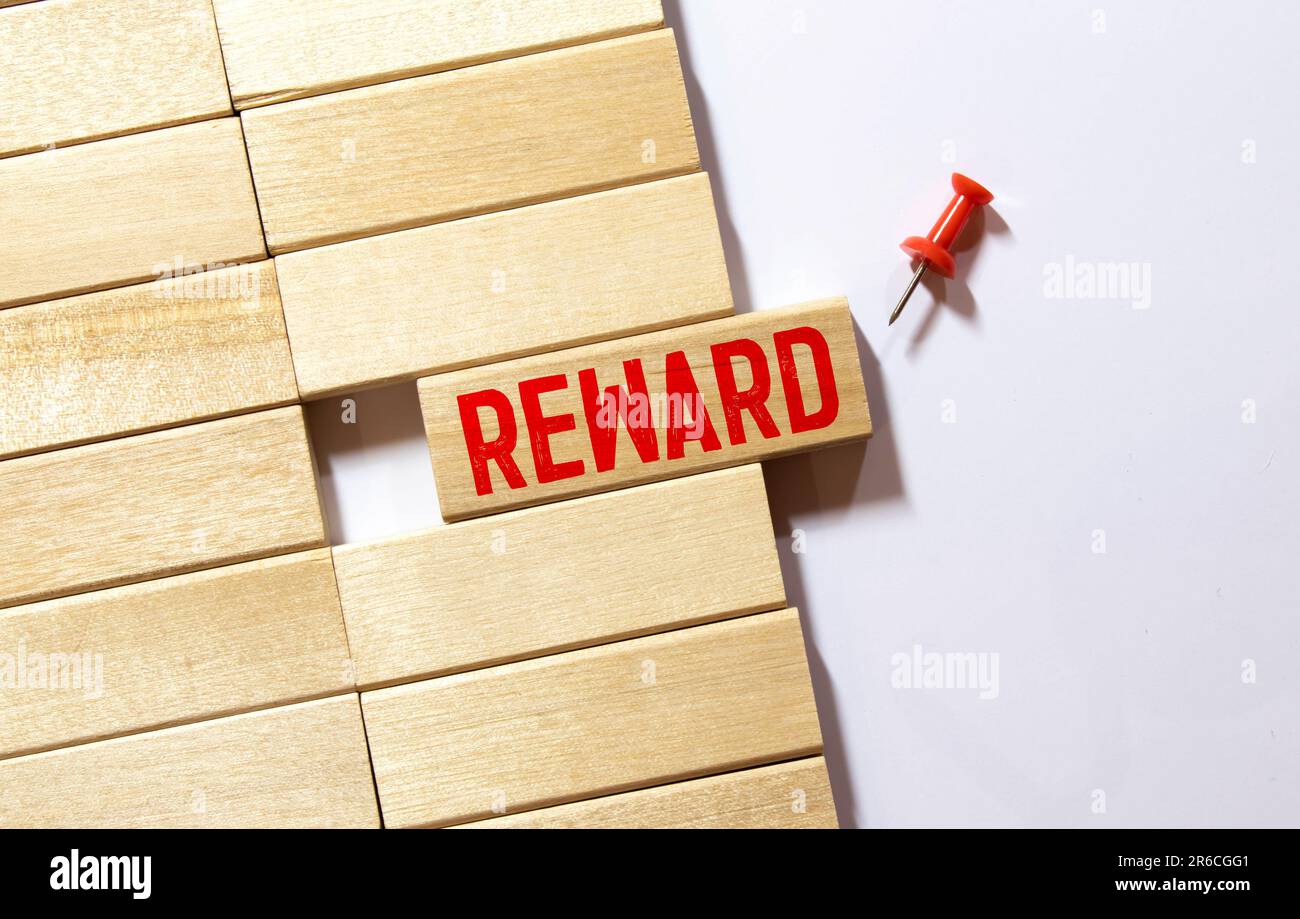 reward word background on wood blocks Stock Photo - Alamy