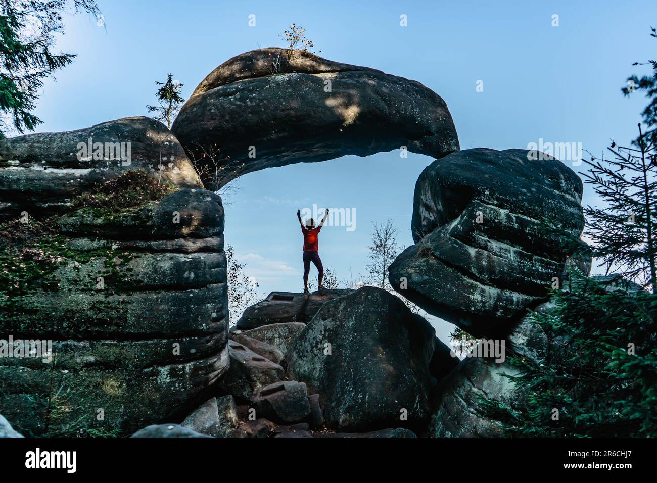 Woman hiker in Rock Gate in nature reserve of Broumov Walls, Czech ...
