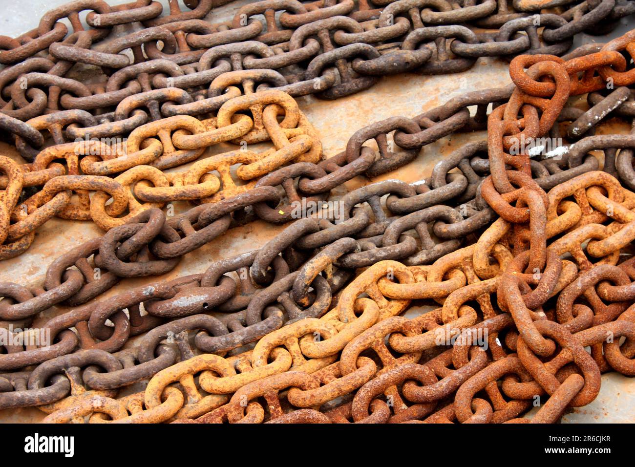 Several rusty metal chains used for anchor hoisting Stock Photo - Alamy