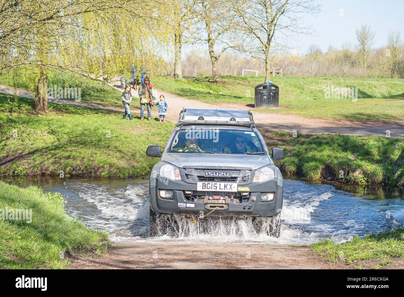 4x4 Council vehicle driving through a water ford in a country park ...
