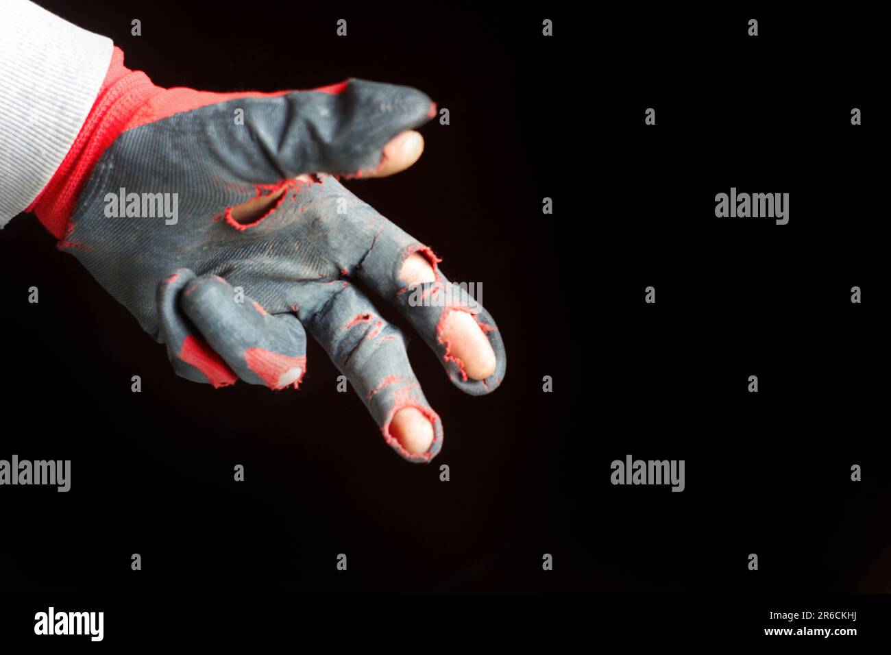 A damaged glove is depicted in the image, showcasing its worn, d Stock ...