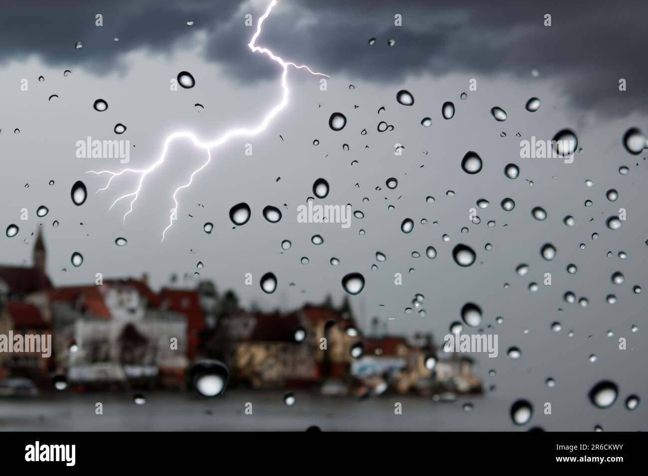 Raindrops on the glass, and the city and lightning outside the window ...