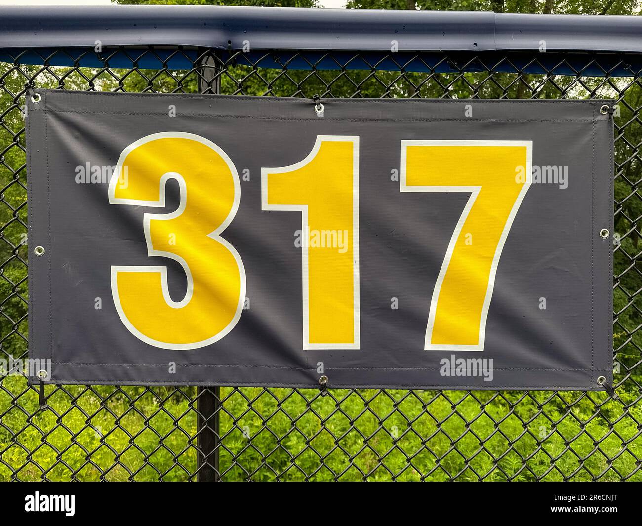 317 foot ft baseball field distance sign in yellow and black mounted on ...