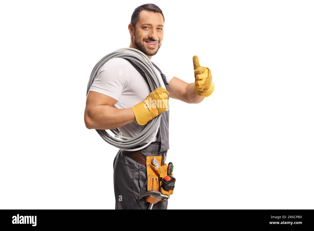 Electrician holding cables and gesturing thumbs up isolated on white ...