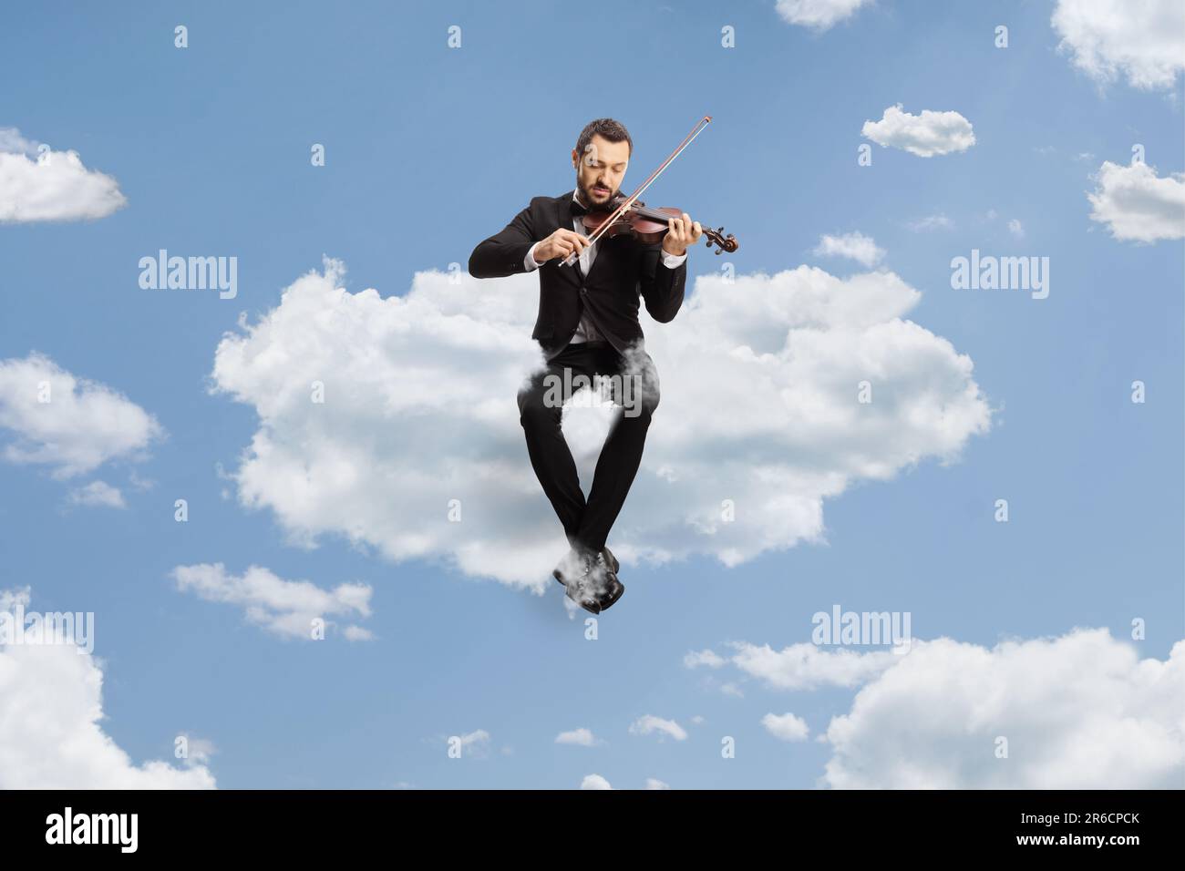 Violinist sitting on a cloud and playing a violin up in the sky Stock ...