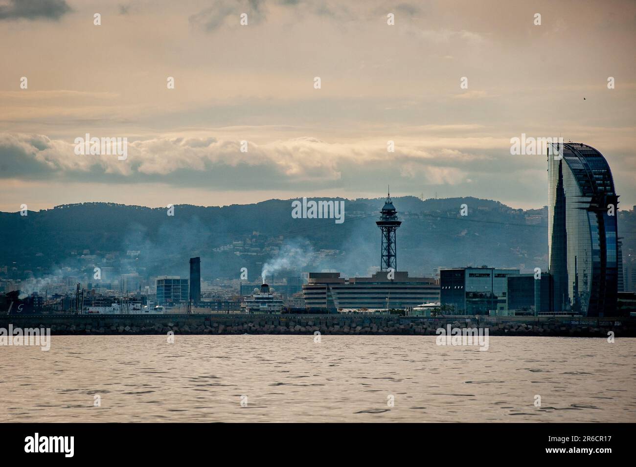 Cruise ships smokestacks give off smoke in the port of Barcelona ...