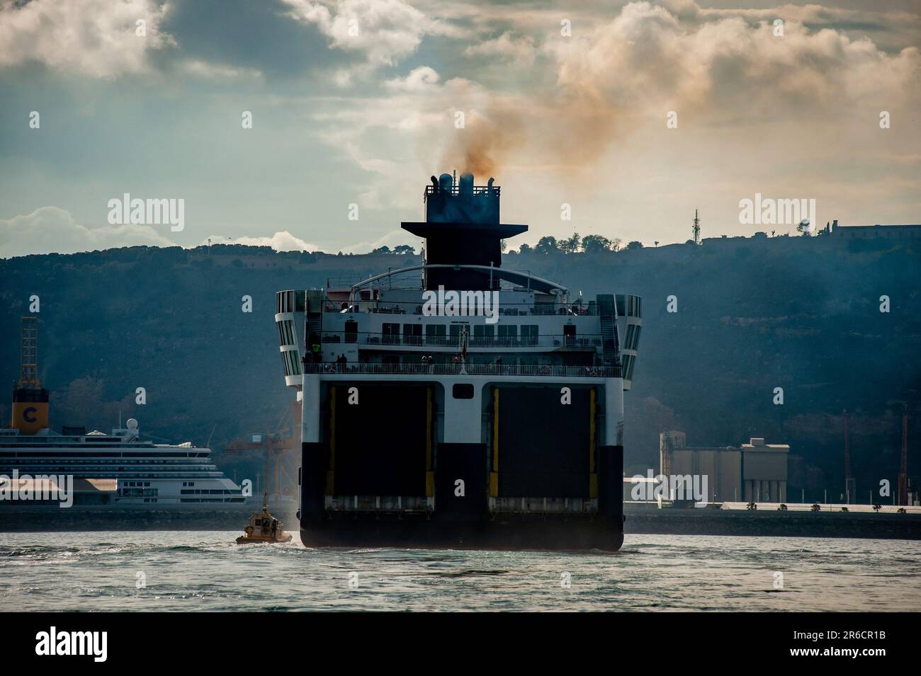 Ferry ship smokestacks gives off smoke while heading the port of ...