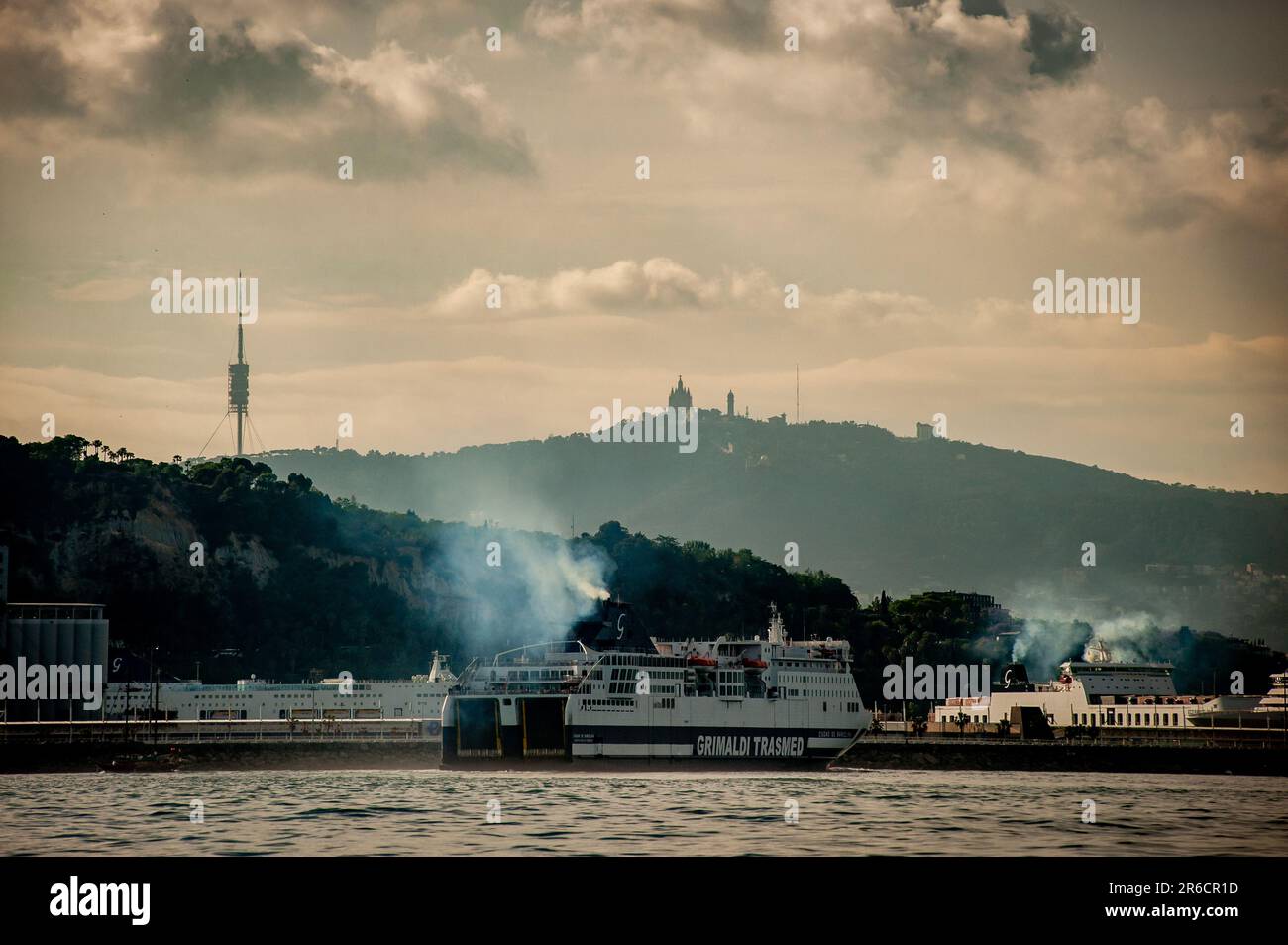 Cruise and ferry ships smokestacks give off smoke in the port of ...