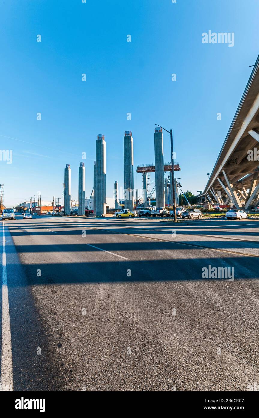 Concrete columns to hold up a highway ramp under construction stand ...