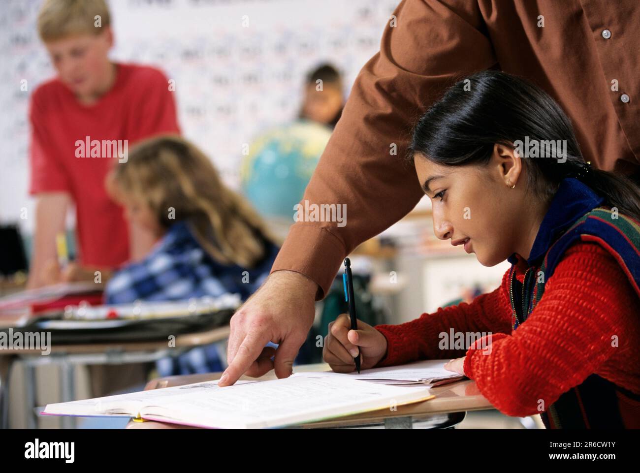 Middle School Students Studying In Class