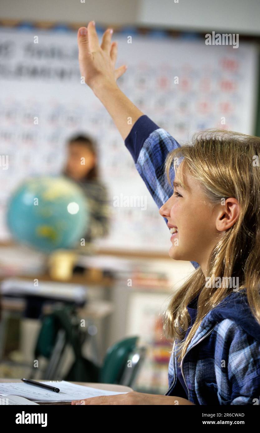 Girl middle school raising hand hi-res stock photography and images - Alamy